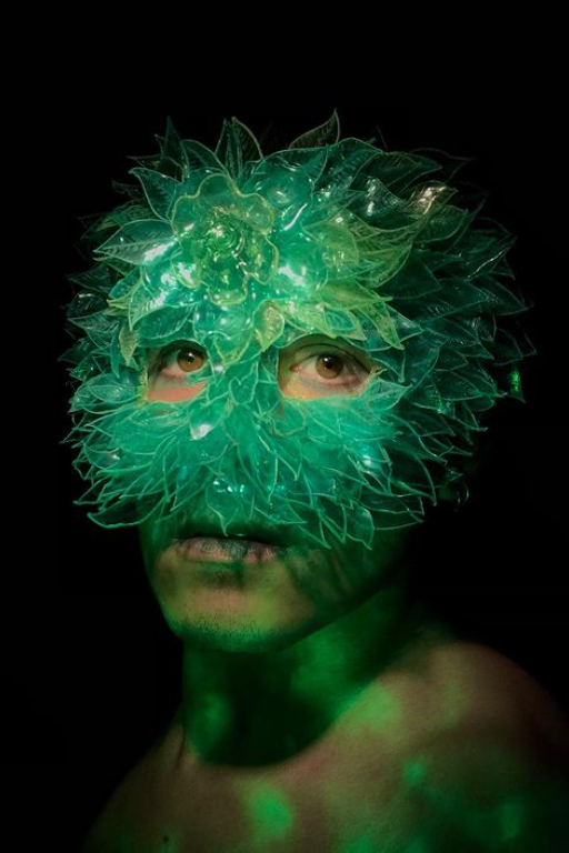 rude-newt301: woman's face in a transparent mask made of melted plastic ...