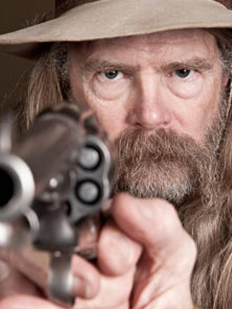 cool-frog601: an old west outlaw pointing a gun